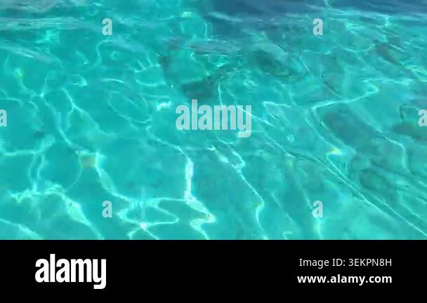Turquoise reflections in the crystal-clear water of an ocean Stock ...