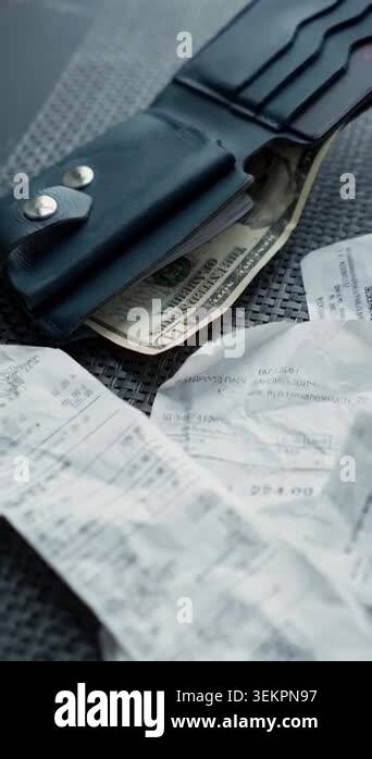 Close-up of invoices and receipts for goods from a store. Inflation and ...