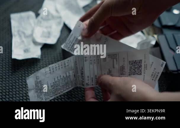 Close-up of invoices and receipts for goods from a store. Inflation and ...