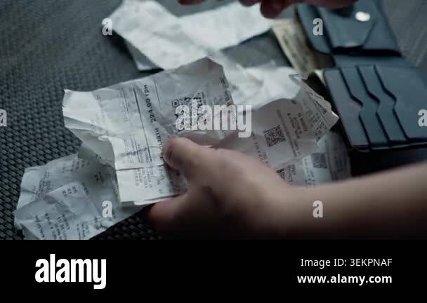 Close-up of invoices and receipts for goods from a store. Inflation and ...