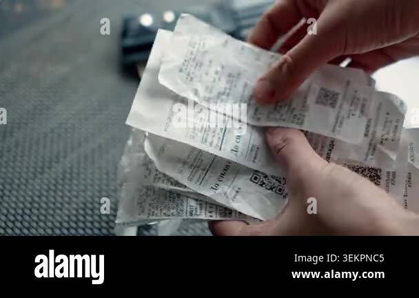 Close-up of invoices and receipts for goods from a store. Inflation and ...