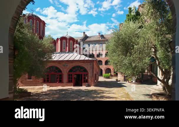 The fortified Byzantine complex of Koutloumousi Monastery featuring red ...