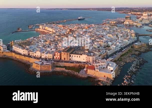 Aerial view of the historic island of Gallipoli at sunset. The golden ...