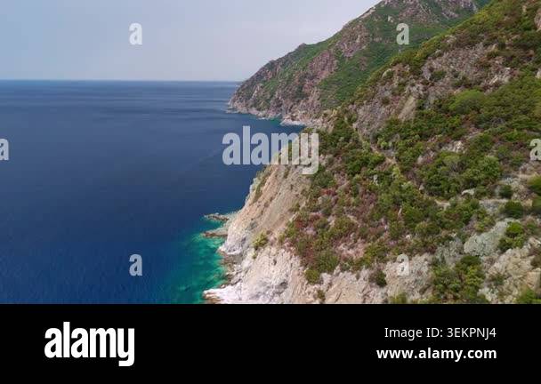 Aerial View of Gregoriou Monastery, built on the rocky coastline of the ...