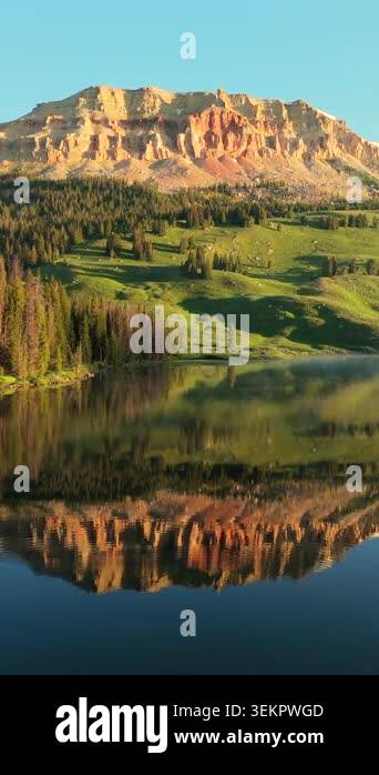 Vertical Screen: Montana USA alpine lake with perfect mirror reflection ...