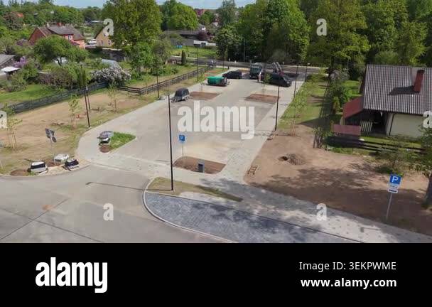 Valmiera, Latvia - May 28, 2026: Construction workers manage vehicles ...