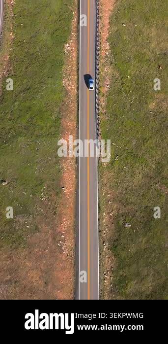 Vertical Screen: Beartooth Highway in Montana USA as a white car ...