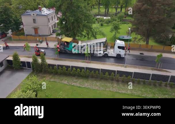 Valmiera, Latvia - May 28, 2026: Road construction team uses an asphalt ...