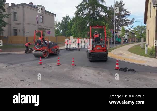 Valmiera, Latvia - May 28, 2026: Road construction team in orange ...