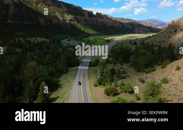 Aerial Montana USA view captures scenic mountain highway winding ...