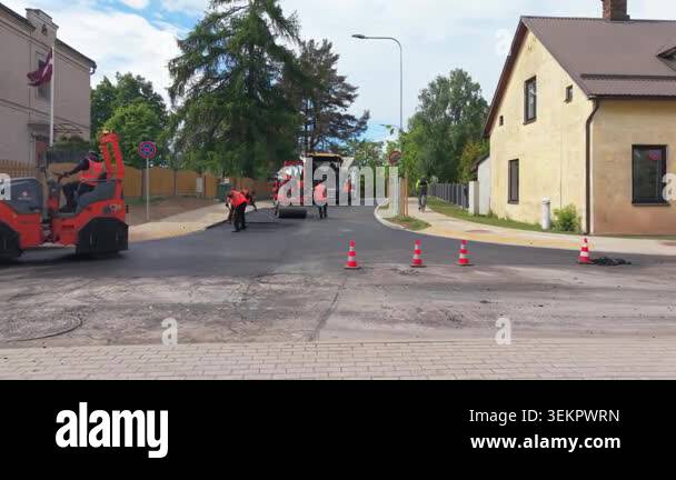 Valmiera, Latvia - May 28, 2026: Road construction team in orange vests ...