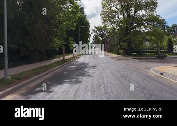 Valmiera, Latvia - May 28, 2026: Tree-lined road with new asphalt ...