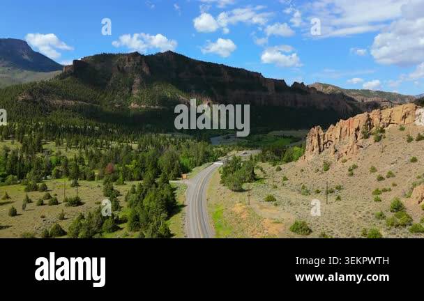 Aerial Montana USA view captures scenic highway curving through a ...