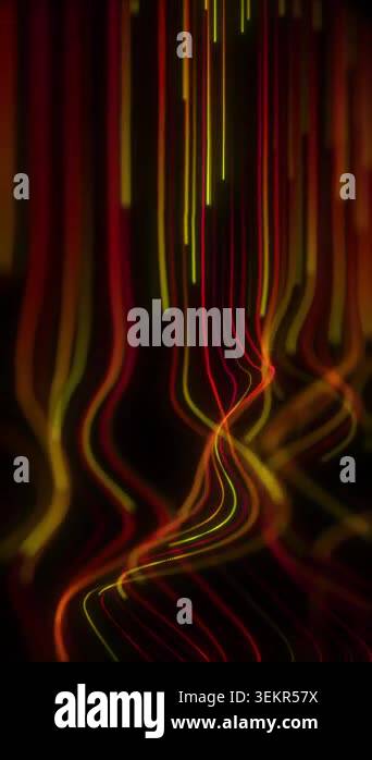 Vertical red yellow neon light waves black background. Flowing glowing ...