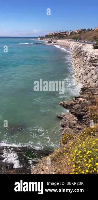 Blue calm sea stretches alongside the promenade creating relaxing ...