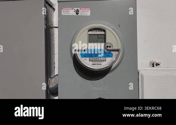 Close up video footage of a digital electricity meter installed on an ...