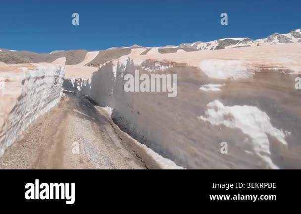 Snowy mountain landscape. on top of the mountain. Snow-covered mountain ...