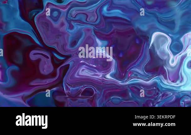 Neon colored liquid paint creating psychedelic swirling patterns with ...