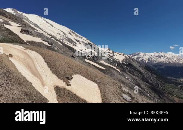 Snowy mountain landscape. on top of the mountain. Snow-covered mountain ...