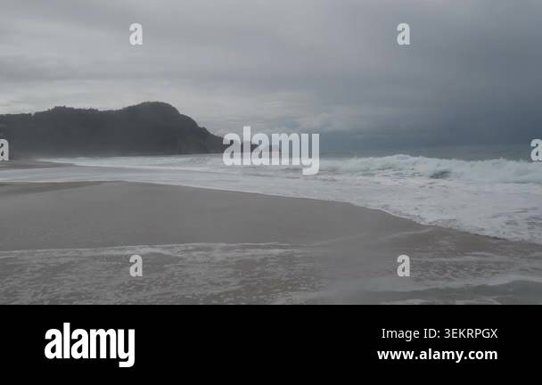 Waves beach cliff. sandy beach, sea foam, dramatic sky. High quality 4k ...