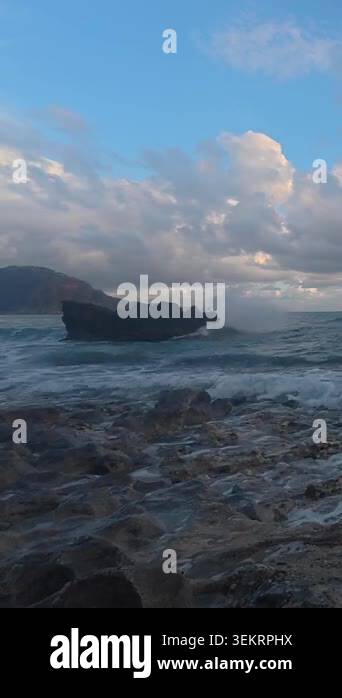 Cloudy beach waves. Waves beach cliff. sandy beach, sea foam, dramatic ...