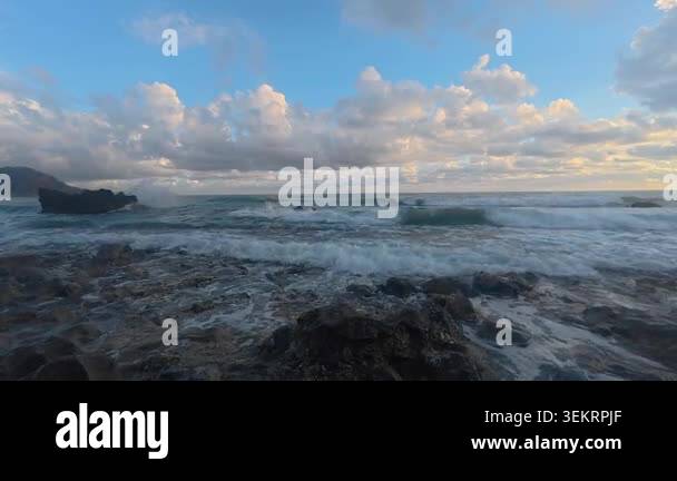 Waves beach cliff. sandy beach, sea foam, dramatic sky. High quality 4k ...
