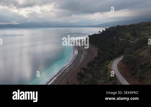 view from a drone of a lake in the mountains, turquoise water. High ...