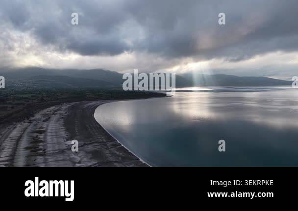 sunbeams from behind the clouds over the lakes. view from a drone of a ...