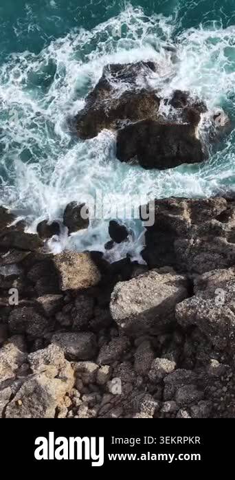 Cliffside turquoise sea. Ocean rocky cliff. Waves crashing rocks. High ...