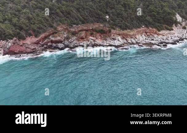 Cliffside turquoise sea. Ocean rocky cliff. Waves crashing rocks. High ...