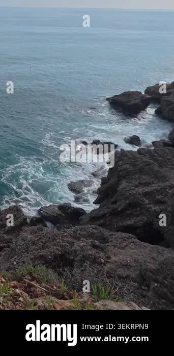 Cliffside turquoise sea. Ocean rocky cliff. Waves crashing rocks. High ...