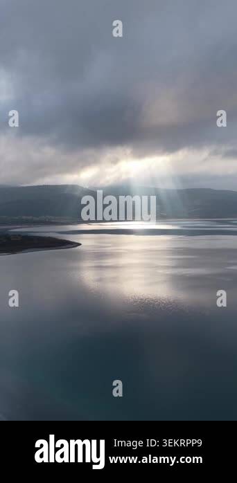 sunbeams from behind the clouds over the lakes. view from a drone of a ...
