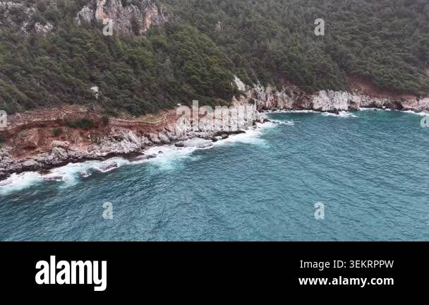 Cliffside turquoise sea. Ocean rocky cliff. Waves crashing rocks. High ...