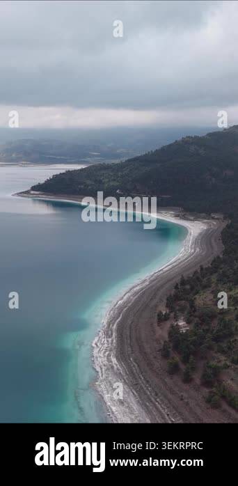 view from a drone of a lake in the mountains, turquoise water. High ...