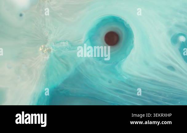 Organic cell structure simulated with teal and white ink swirling ...