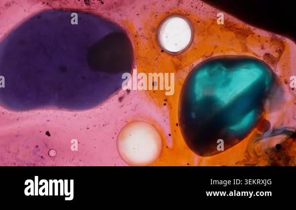 Science-inspired macro shot of silver bubbles interacting with teal and ...