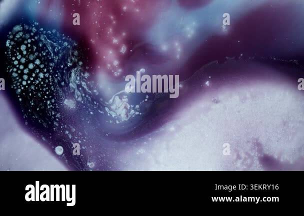 Abstract cosmic visual featuring a swirling purple galaxy and white ...