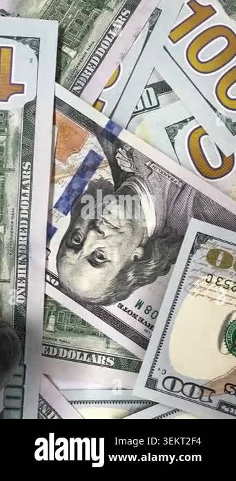 This shows money being counted with different denominations spread out ...