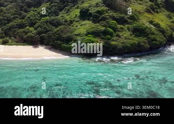 Aerial view of a beautiful hidden tropical beach with turquoise coral ...