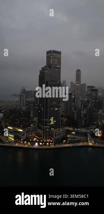 Aerial view of a modern skyscraper on the waterfront of Hong Kong at ...