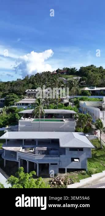 Aerial drone footage revealing modern luxury villas with private pools ...