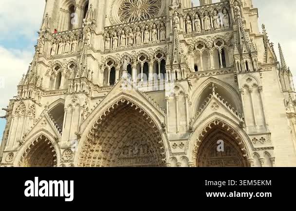 Amiens Cathedral facade with rose window and ornate gothic stone ...