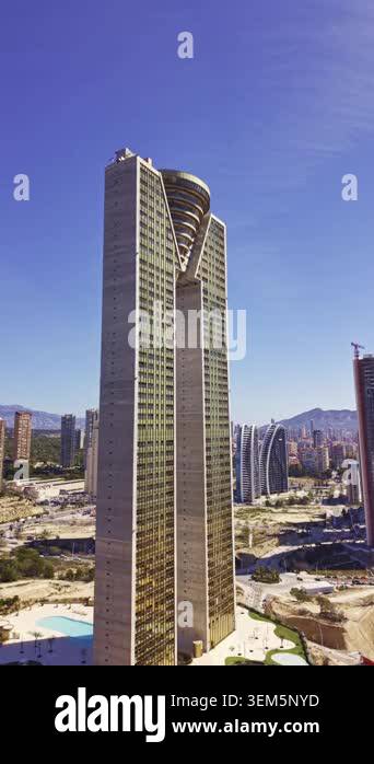 Modern skyscraper architecture with unique design against clear blue ...