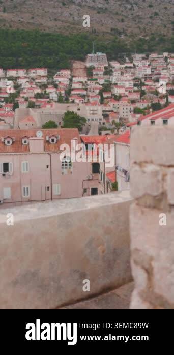 terracotta rooftop panorama from terrace, stone balustrade foreground ...