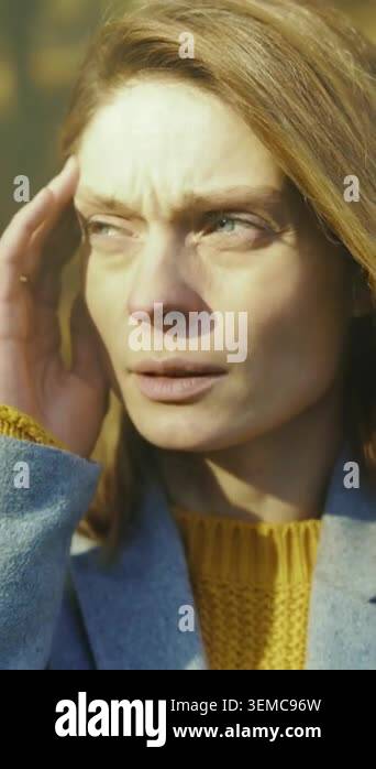 Caucasian woman closeup under autumn sunlight soft tearful gaze subtle ...
