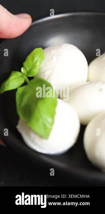 Mini mozzarella or mini burrata soft, young cheese lunch or dinner ...