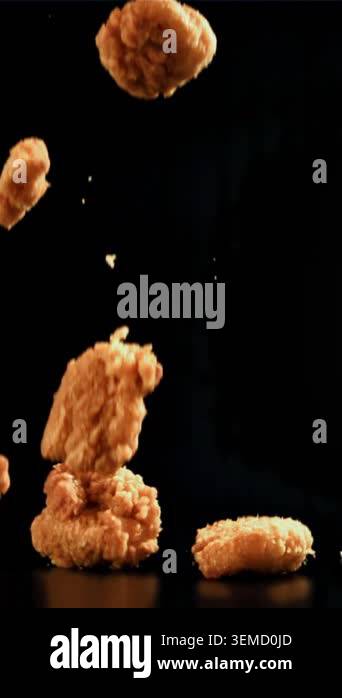 The nuggets fall on the table. Filmed is slow motion 1000 fps. High ...