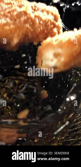 Nuggets with splash oil. Filmed is slow motion 1000 fps. High quality ...