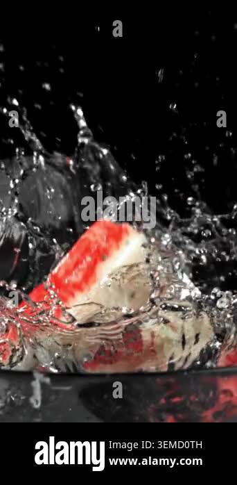 Crab sticks fall into the water. Filmed on a high-speed camera at 1000 ...