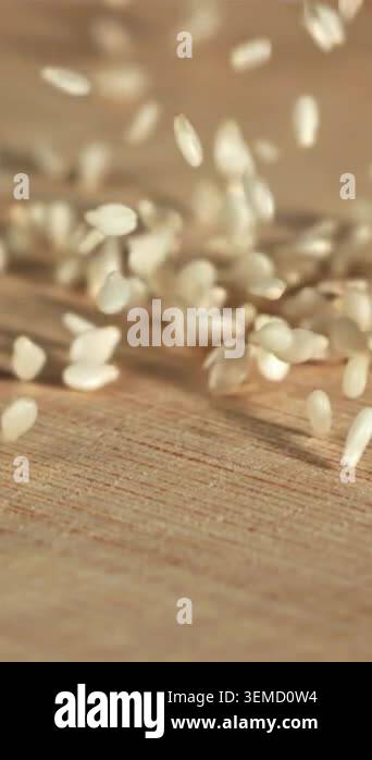 Falling sesame seeds on the table. Filmed is slow motion 1000 fps. High ...